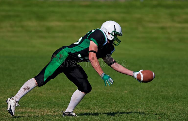Catching the Football stock photo. Image of running, field - 11476662