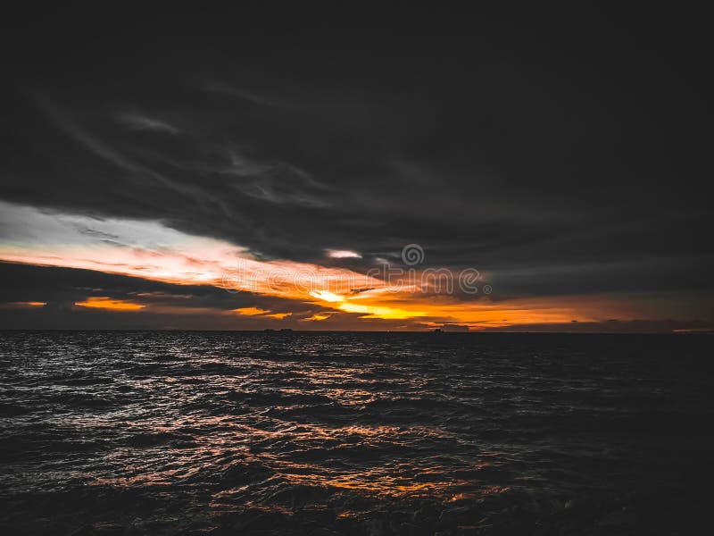 Catching Sunset during Storm Stock Photo - Image of oceansunset, ocean ...