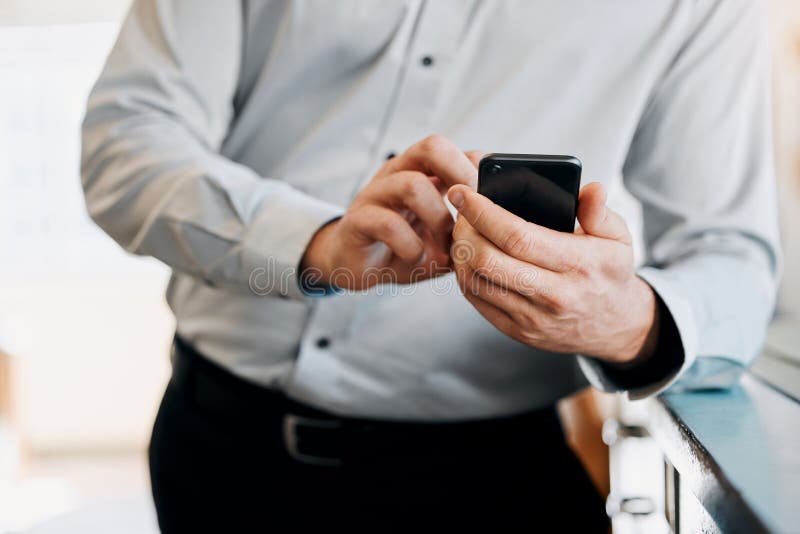 Catching Up on Text Messages before the Busy Day. an Unrecognisable ...