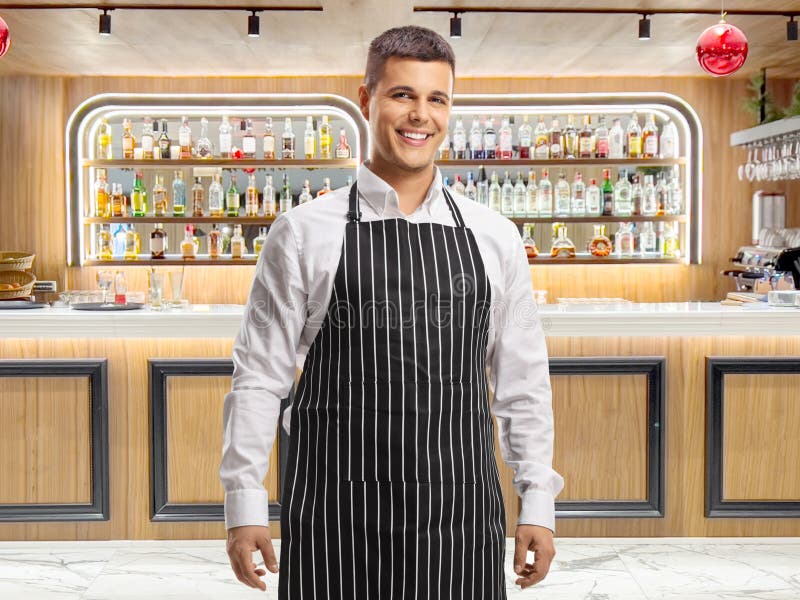 Caterer wearing an apron stock image. Image of lounge - 310586791