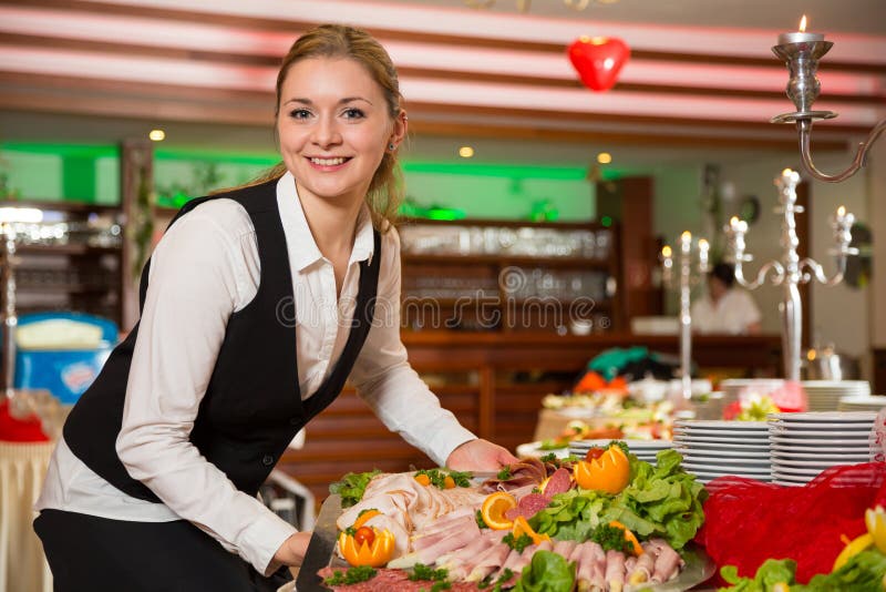 Catering Service Employee Preparing a Buffet Stock Photo - Image of ...