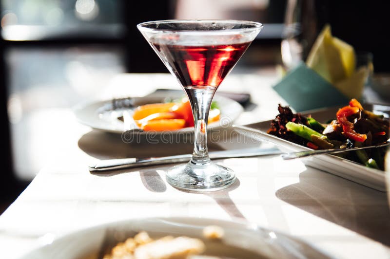 Bartender at Counter with Bottles and Glass of Whiskey in Bar, Closeup ...