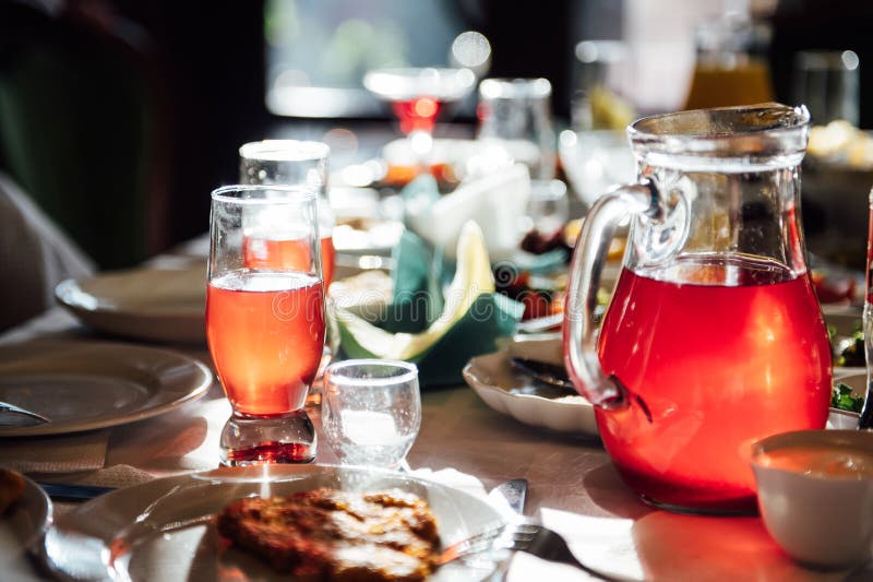 Bartender at Counter with Bottles and Glass of Whiskey in Bar, Closeup ...