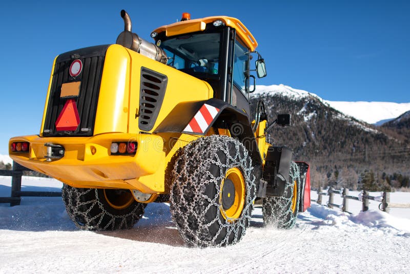 Caterpillar with Big Chains on the Snow Stock Photo - Image of wheels ...