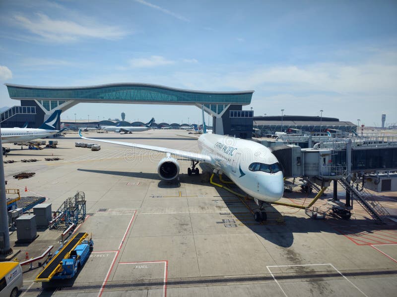 A Cathay Pacific Airplane in Front of the Record-breaking 200m HKIA Sky ...