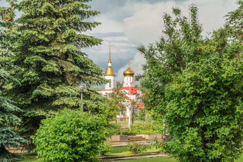 Cathedral is Partially Visible between the Big Foreground Trees, an ...