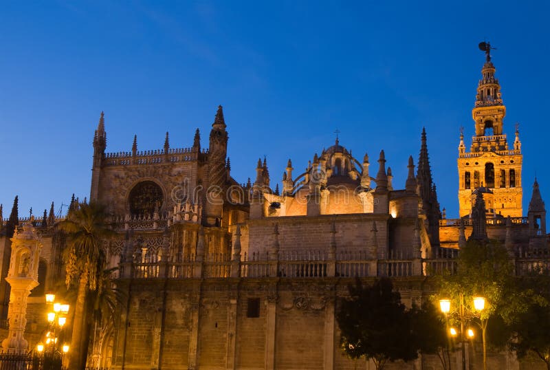 Cathedral of Seville at Sunset Stock Photo - Image of hour, belltower ...