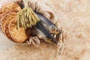 Catholic Still Life of Five Loaves of Bread and Two Fish Stock Photo ...