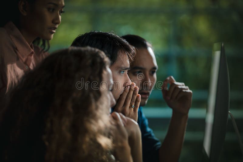 Caucasian and Asian Businessmen are Constantly Watching Over the Stock ...