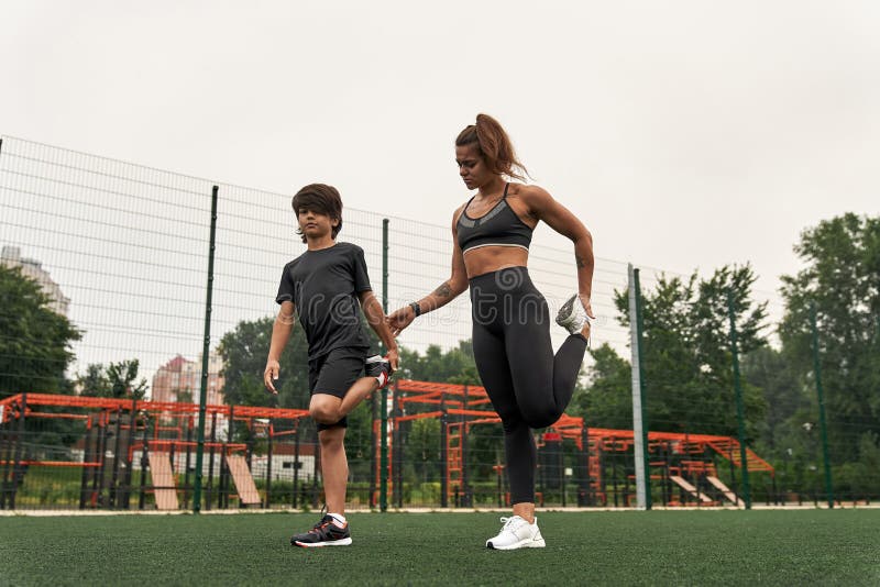 Caucasian Athletic Mother Help Son Stretch Leg Stock Image Image Of