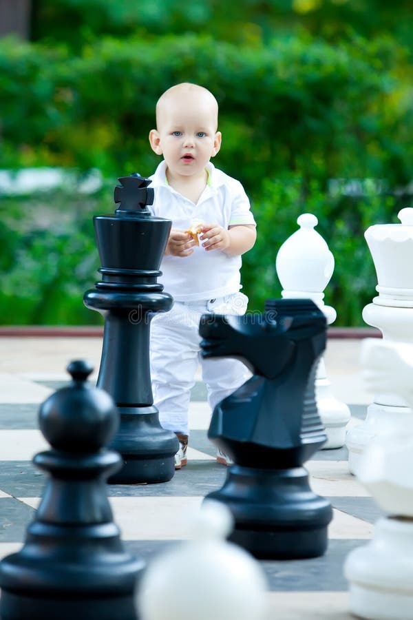 Caucasian Baby Boy Palys Chess Stock Photo - Image of beauty, family ...