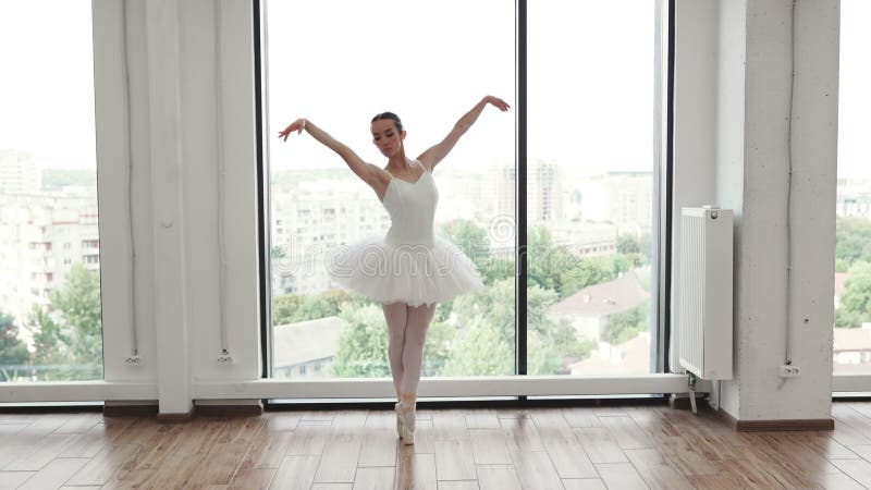 Caucasian Ballerina Posing in Bright Class Studio with Panoramic ...