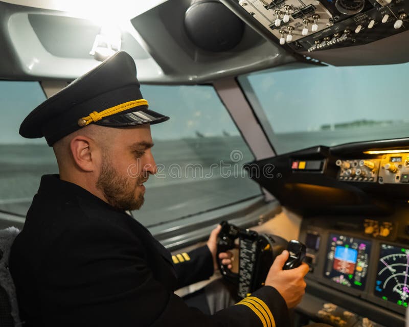 Caucasian Bearded Man Smiling while Sitting in a Flight Simulator ...