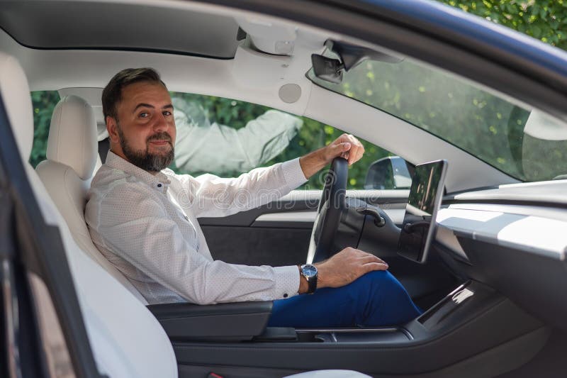 Caucasian Bearded Man in a Suit Driving a Car. Stock Image - Image of ...