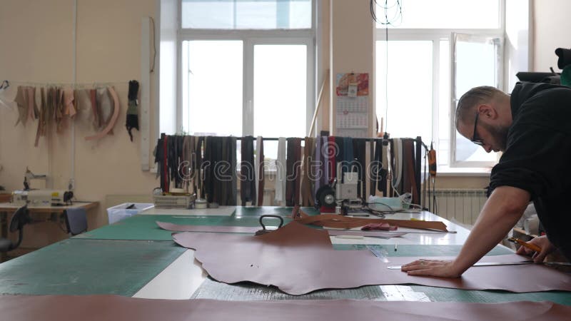 Caucasian Bearded Man Working As a Tanner in a Workshop. Stock Footage ...