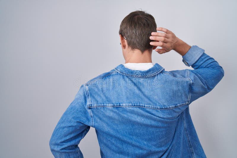 Caucasian Blond Man Standing Wearing Glasses Backwards Thinking about ...