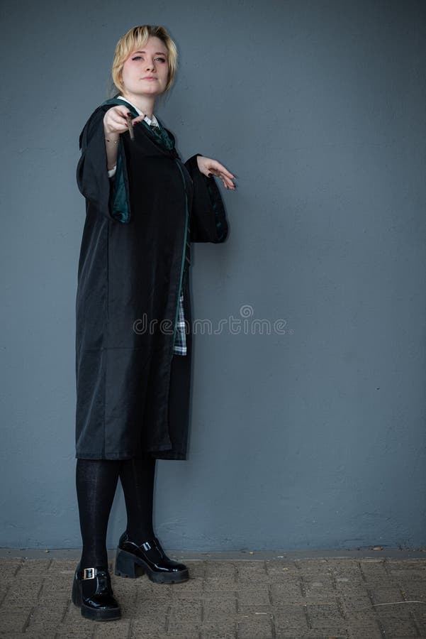 Caucasian Blonde Female Cosplayer Dressed As a Wizard with a Magic Wand ...