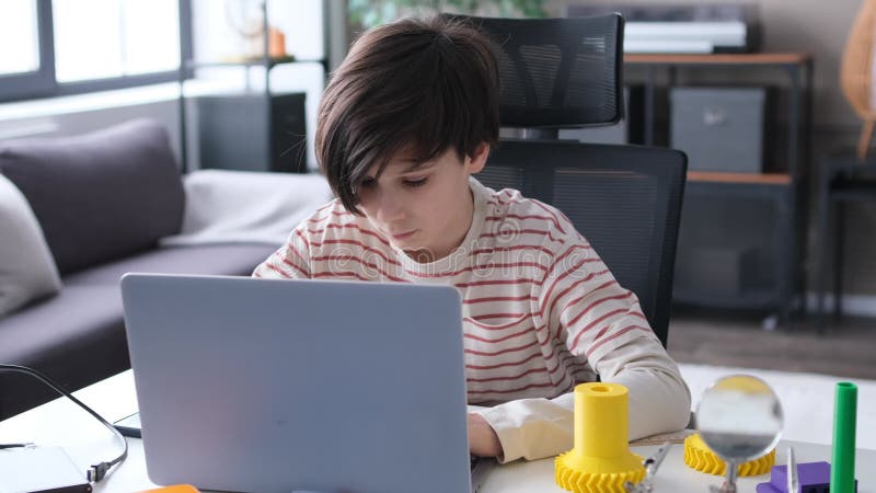 Caucasian Boy Engaged in E-Learning Process at Home Stock Footage ...