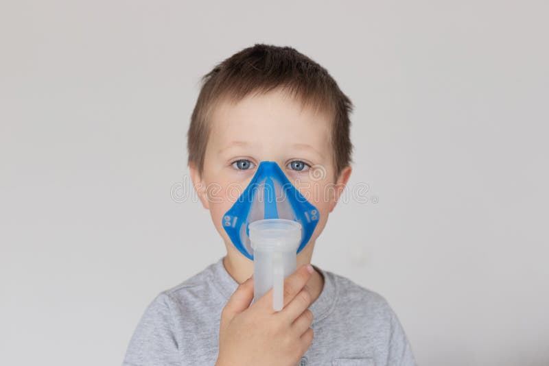 Caucasian Boy with a Mask for Inhalation. Prevention of Bronchitis ...