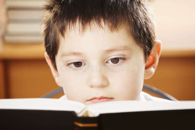 Caucasian Boy Reading Book Closeup Stock Image - Image of education ...