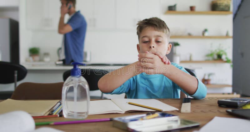 Caucasian Boy Sitting at Table with School Work Stock Footage - Video ...