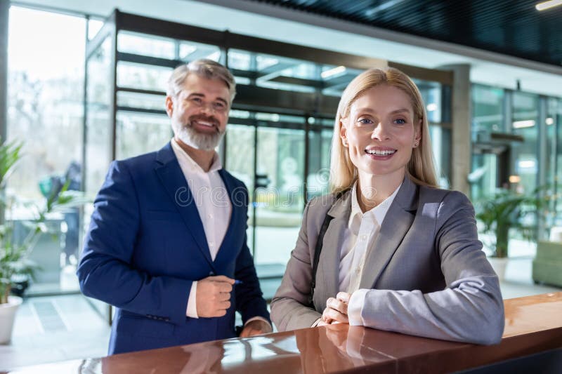 Caucasian Business Client at Receptionist Desk in Office Hall Stock ...