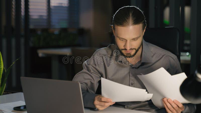 Caucasian Business Man at Evening Office Work Papers Check Documents ...
