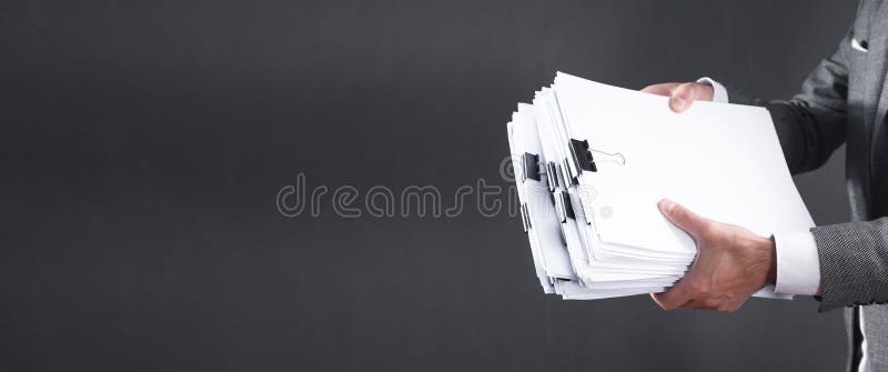Caucasian Businessman Holding Documents in Office Stock Photo - Image ...
