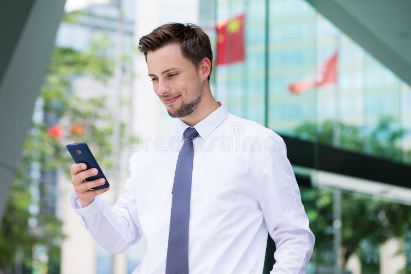 Caucasian Businessman Read on the Cellphone Stock Image - Image of ...
