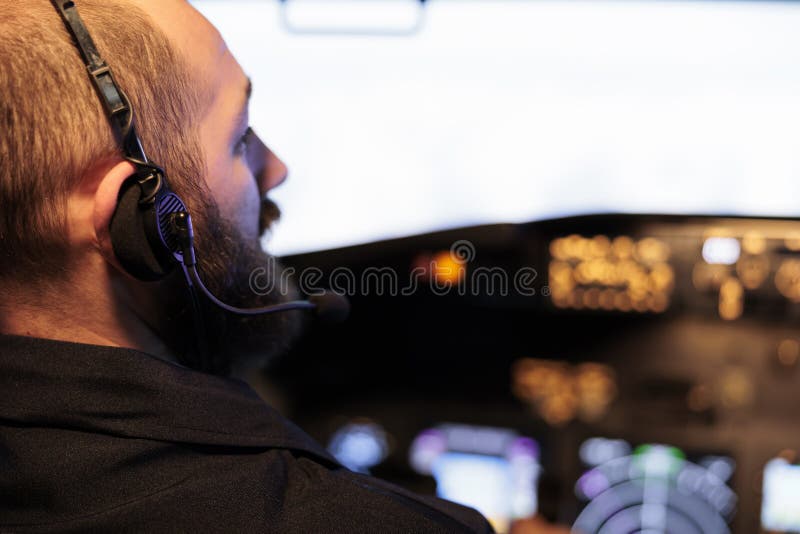 Caucasian Captain Using Airplane Cockpit Command To Fly Jet Stock Image ...