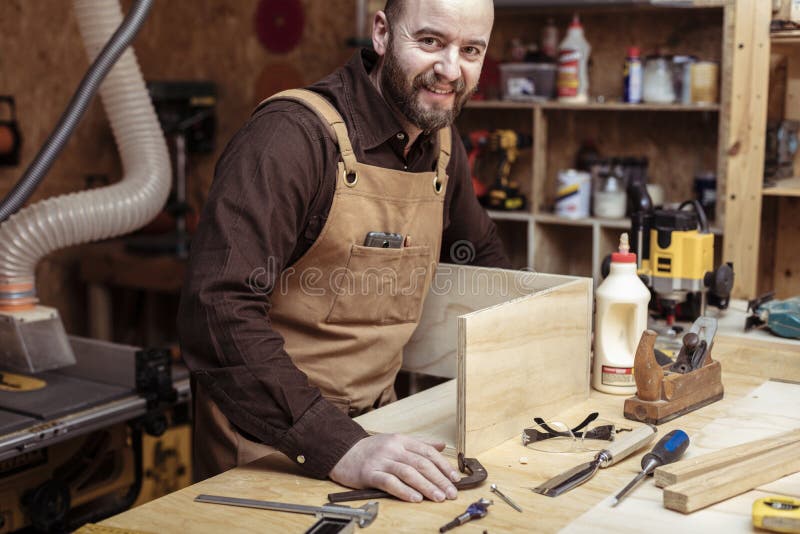 Carpenter at work stock image. Image of artisan, carpenter - 136619669