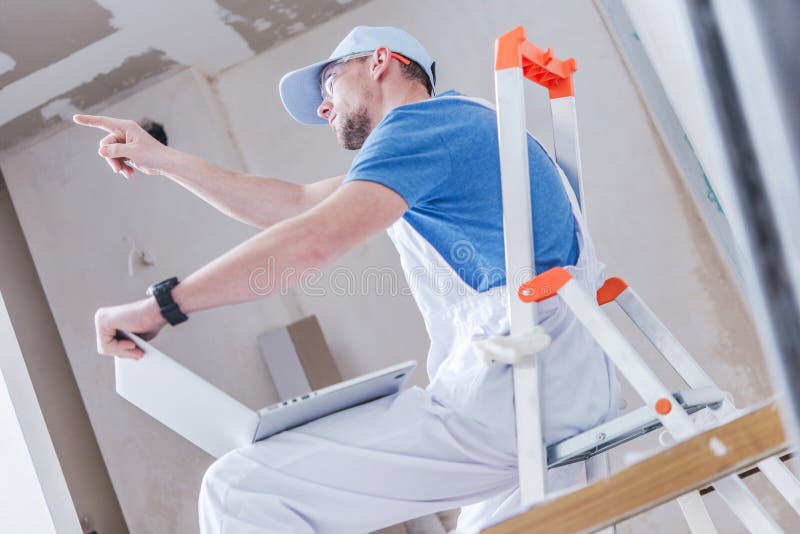 Remodeling Worker Explains stock photo. Image of explain - 100451268