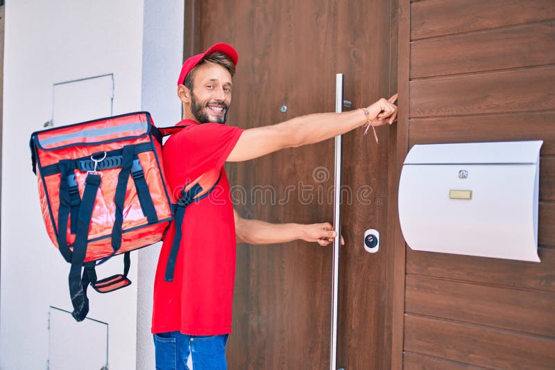 Caucasian Delivery Man Wearing Red Uniform and Delivery Backpack Smilly ...
