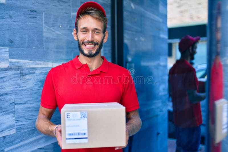 Caucasian Delivery Man Wearing Red Uniform and Delivering Parcel Stock ...