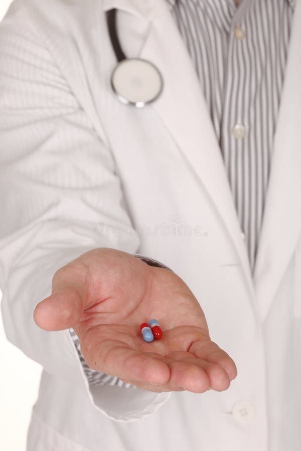 Caucasian Doctor with Medication in Hand Reaching Out Stock Image ...