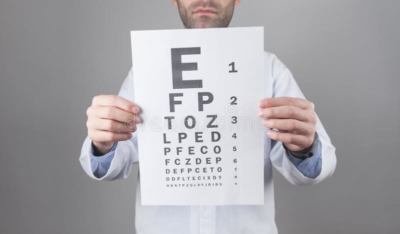 Caucasian Doctor Showing Eye Examination Test Stock Photo - Image of ...