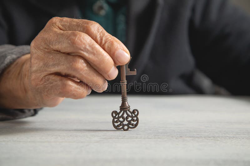 Caucasian Elderly Female Hand with a Old Key Stock Image - Image of ...