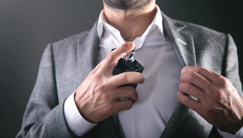 Caucasian Elegant Man Spraying Perfume Stock Photo - Image of bottle ...