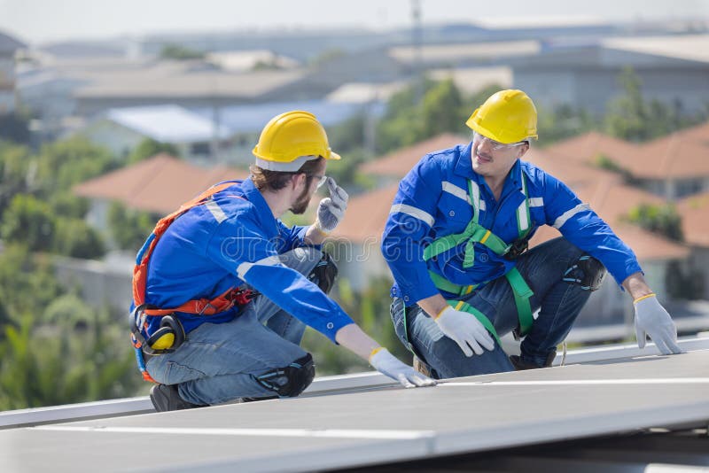 Engineer Checking on Solar Panel on the Factory Rooftop Stock Photo ...