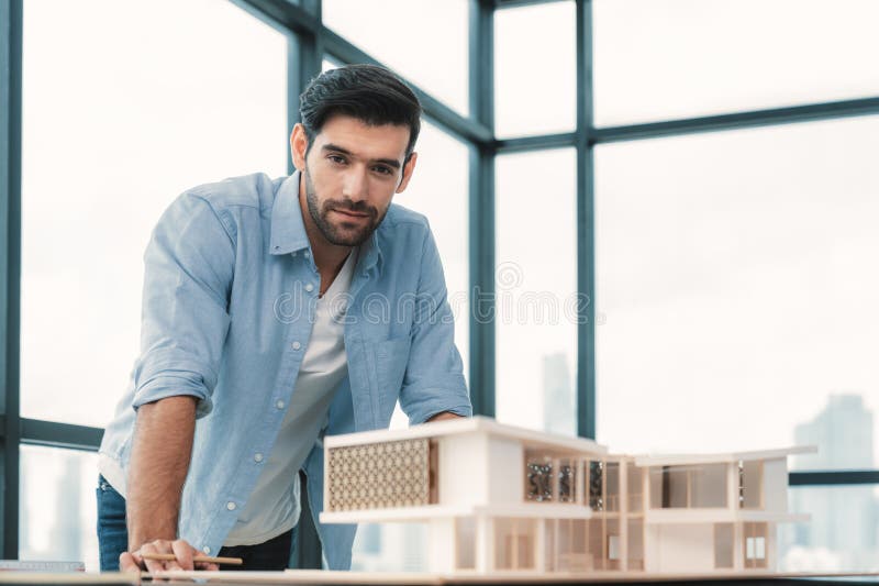 Caucasian Engineer Looking at Camera while Standing with House Model ...