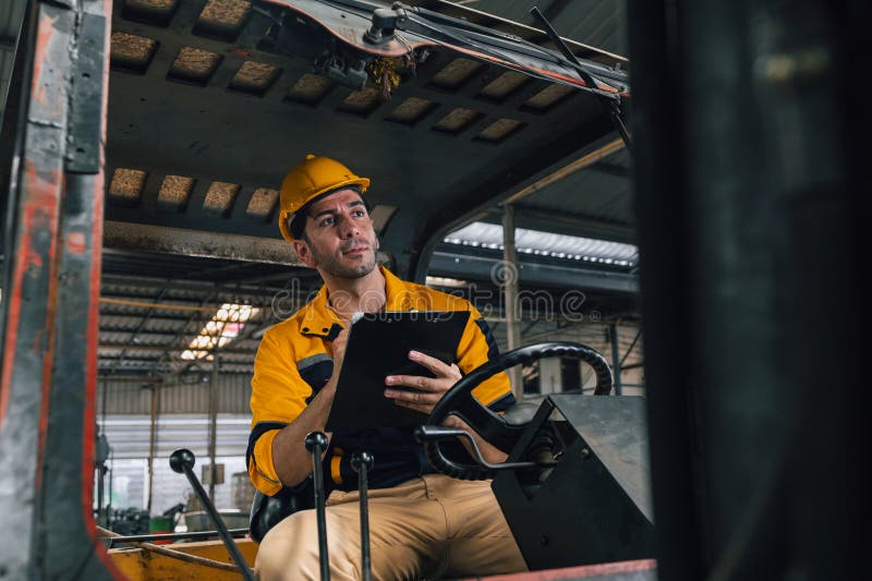 Caucasian Engineer Using a Laptop in a Factory. Man Working in Plastics ...