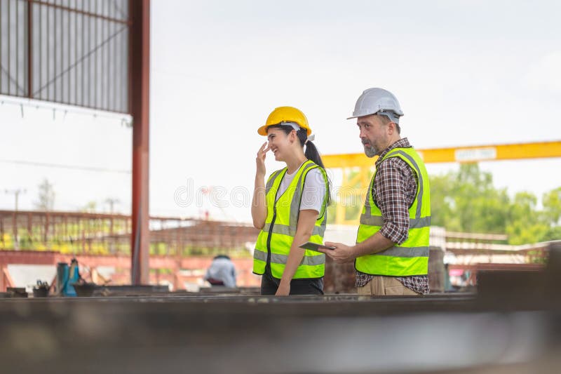 Senior Engineer and Female Foreman Team Checking Project at Precast ...