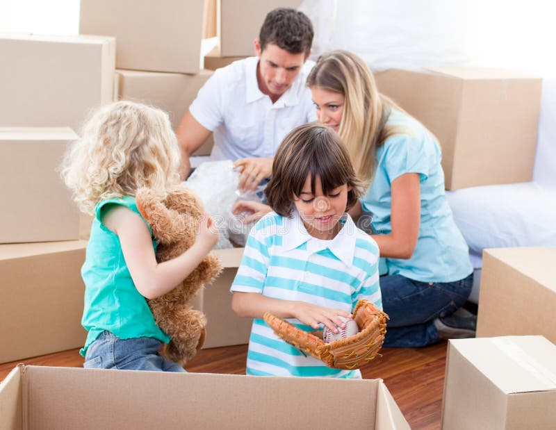 Caucasian Family Unpacking Boxes Stock Image - Image of cute, elated ...
