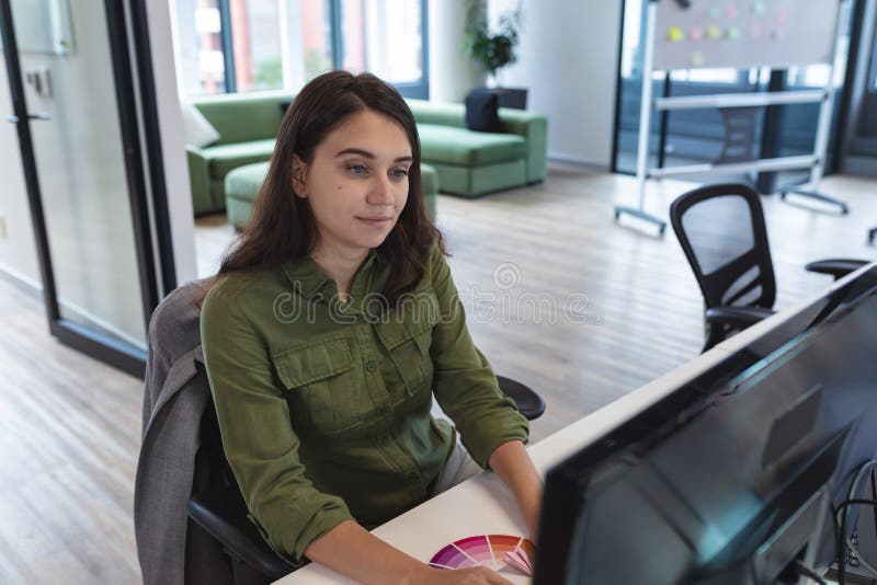 Caucasian Female Creative Worker Sitting at Desk Using Computer Stock ...