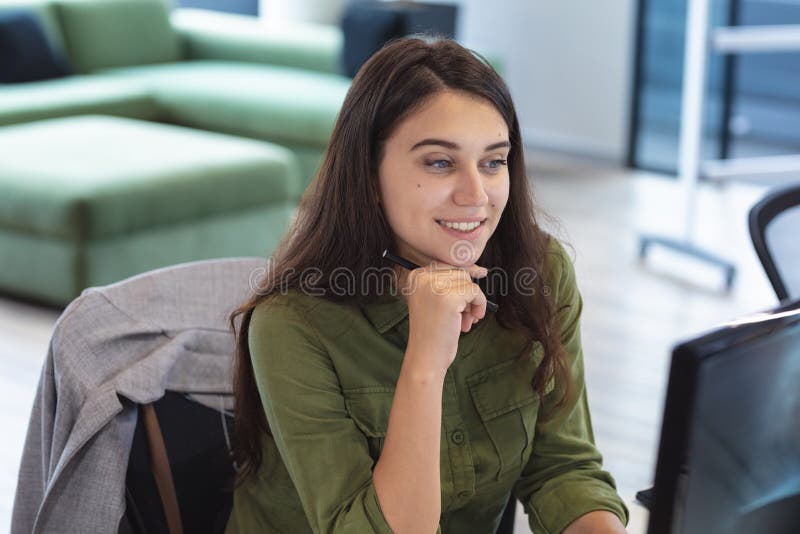 Caucasian Female Creative Worker Sitting at Desk Using Computer Stock ...