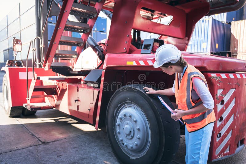 Caucasian Female Engineer Checking Container Forklift for Work Safety ...
