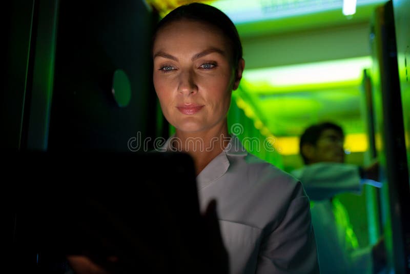 Caucasian Female Engineer Wearing an Apron Using Laptop in Computer ...