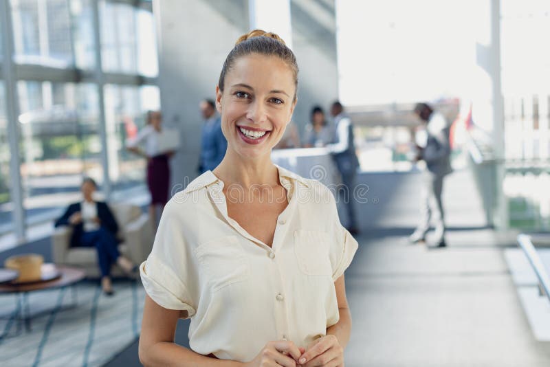 Caucasian Female Executive Looking at Camera while Standing in Modern ...