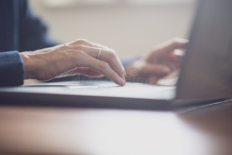 Caucasian Female Hand Using Laptop Computer for Work Lit by the ...