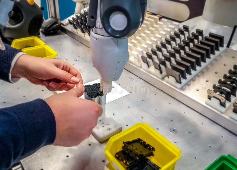 Caucasian Female Operator Standing at an Assembly Workstation with a ...